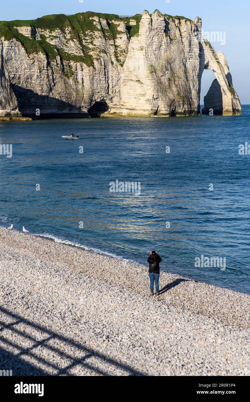 Etretat between historic city, beach of pebbles and cliffs on the cote ...