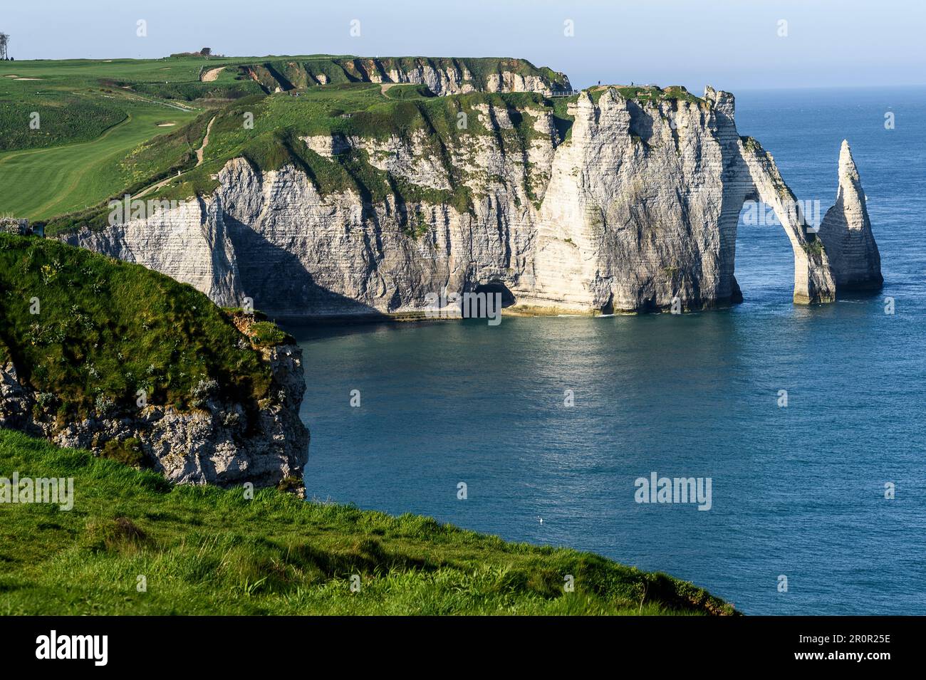 Etretat between historic city, beach of pebbles and cliffs on the cote ...