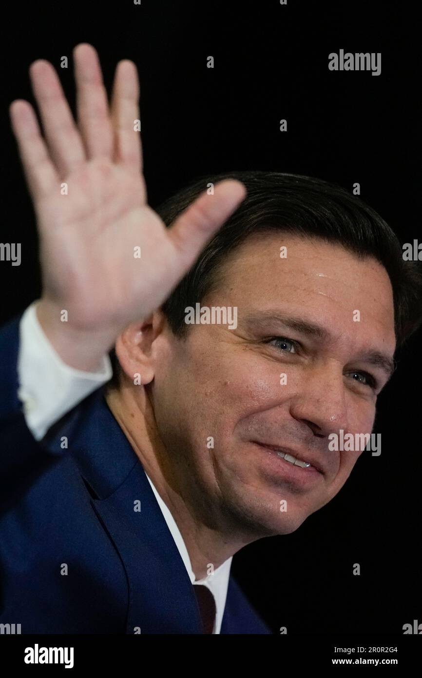Florida Governor Ron DeSantis waves as he arrives for a press ...