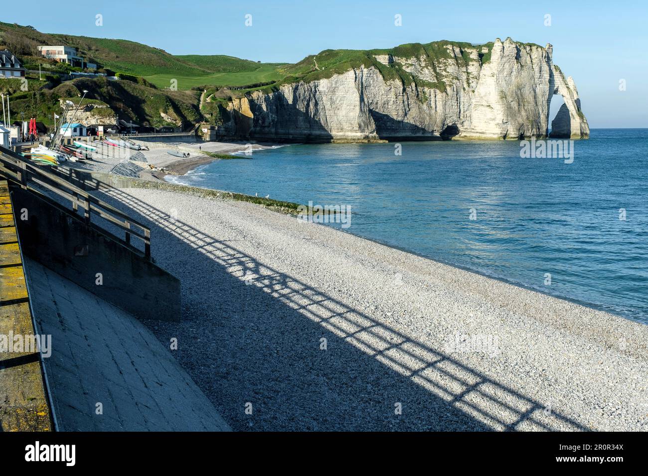 Etretat between historic city, beach of pebbles and cliffs on the cote ...