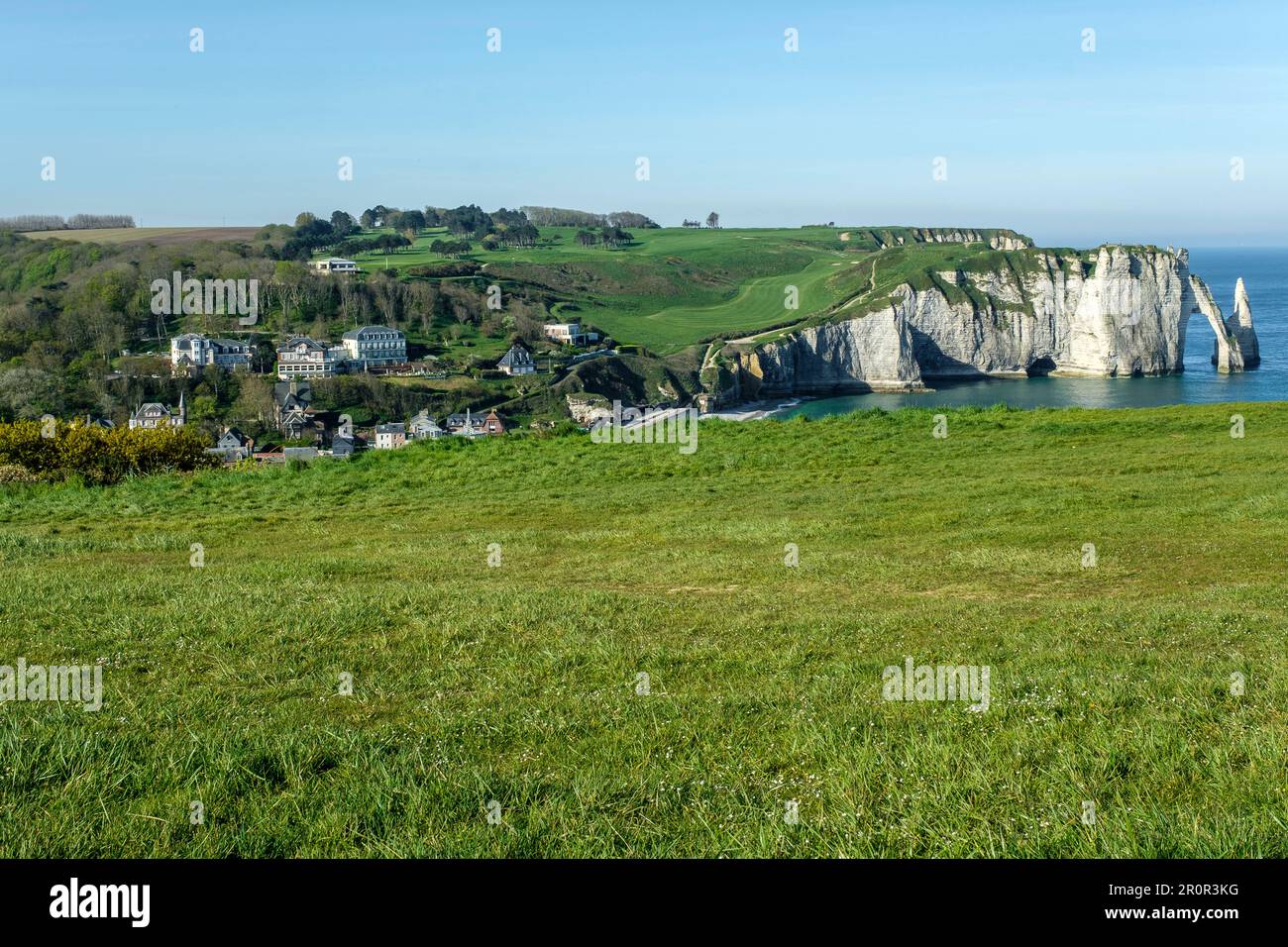 Etretat between historic city, beach of pebbles and cliffs on the cote ...