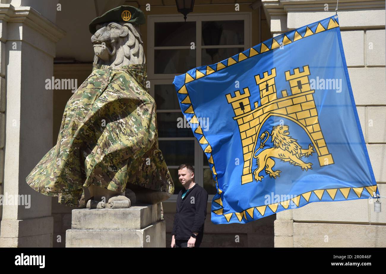 A sculpture of a lion, seen in front of the entrance to the Lviv City ...