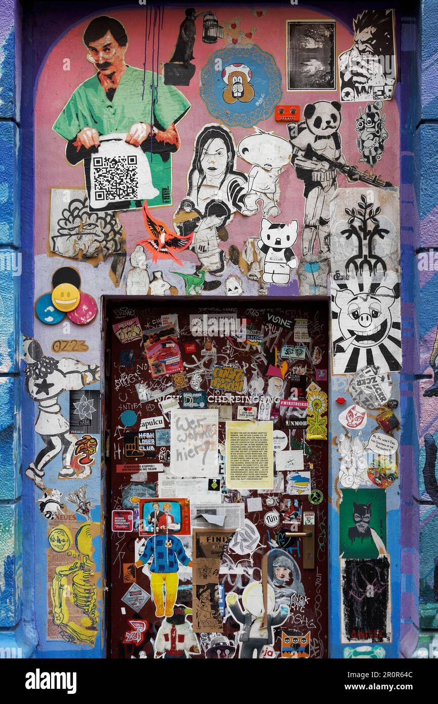 Street art, facade completely covered with paste-ups and stickers, Cafe ...