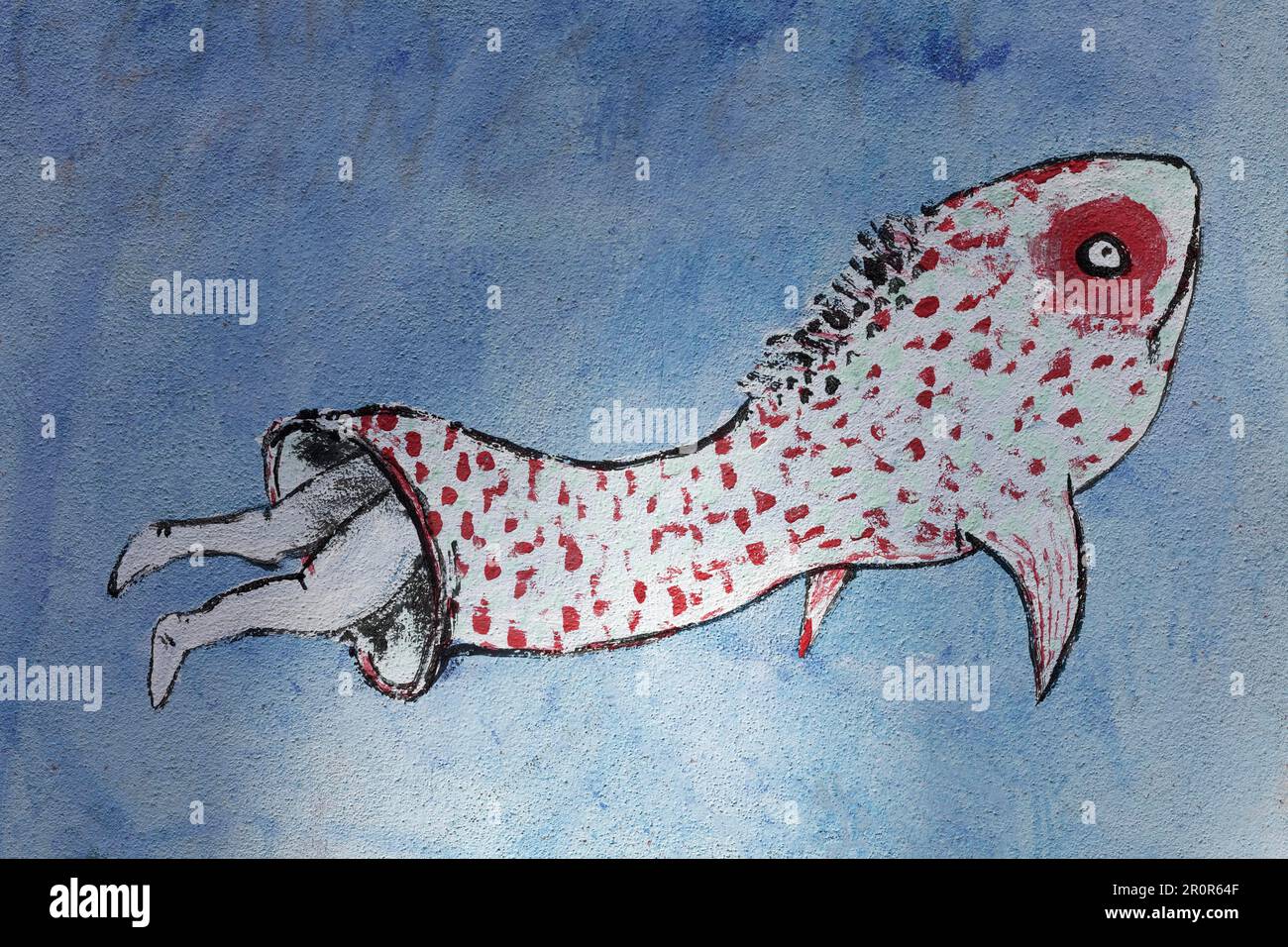 Surreal graffiti, man slips into the skin of a fish, transformation ...