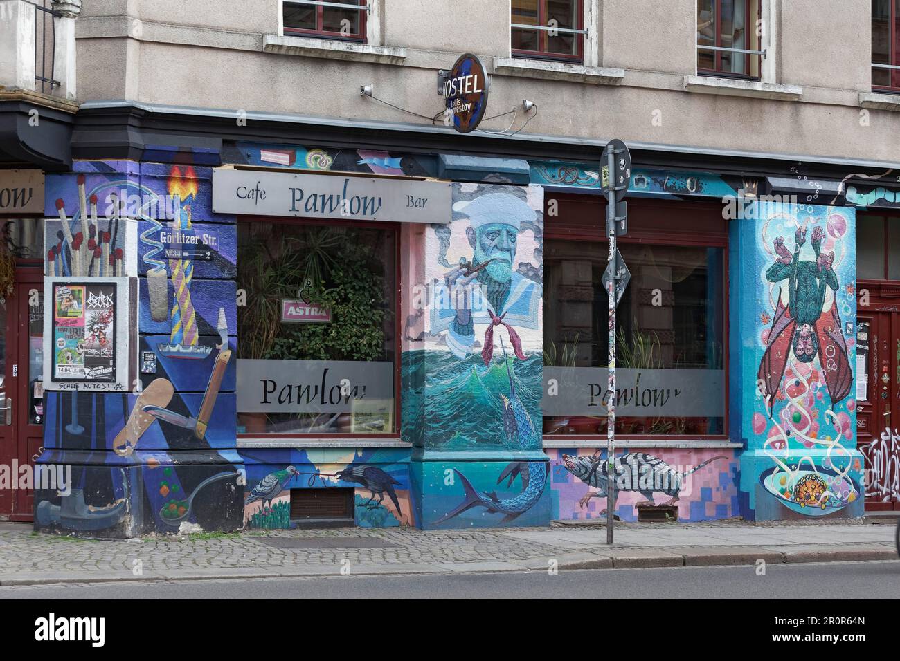 Cafe Pavlov, colourfully painted facade, figures sailor, bat, punky pub ...