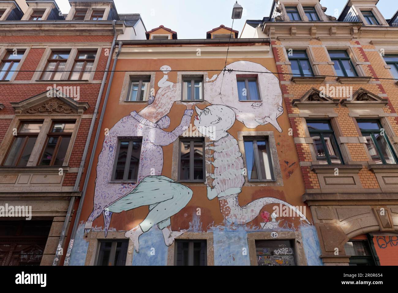 Surreal graffiti, figure of a human caterpillar, unrenovated ...