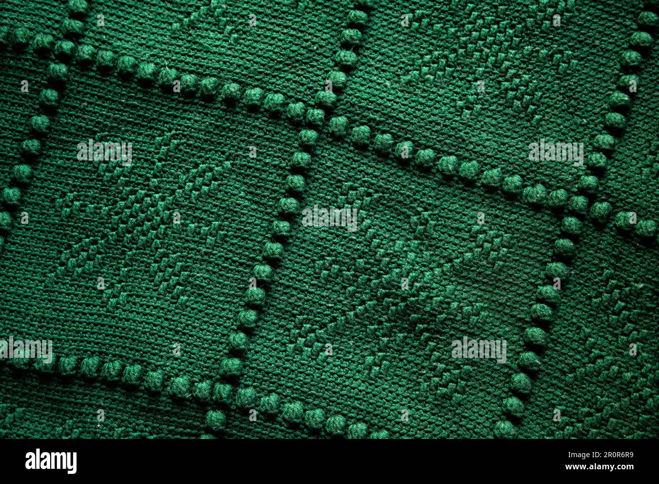 texture green crocheted or knitted blanket with a snowflake pattern ...