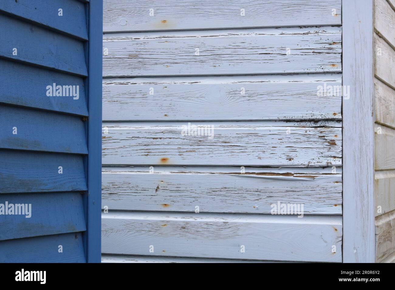 Two shades of blue coloured wooden panelled corner of shed or hut Stock Photo - Alamy