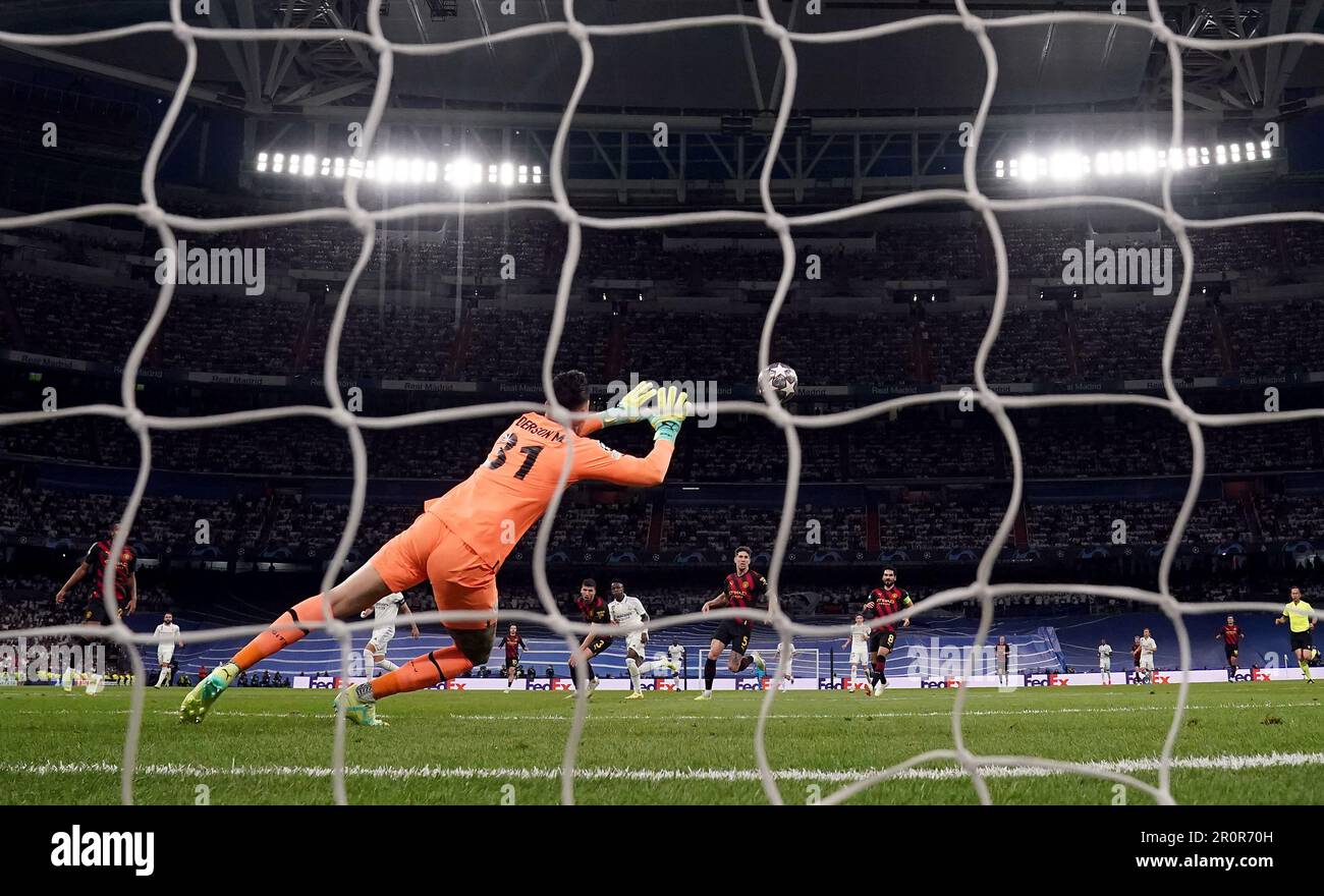 Real Madrid's Vinicius Junior scores their side's first goal of the ...