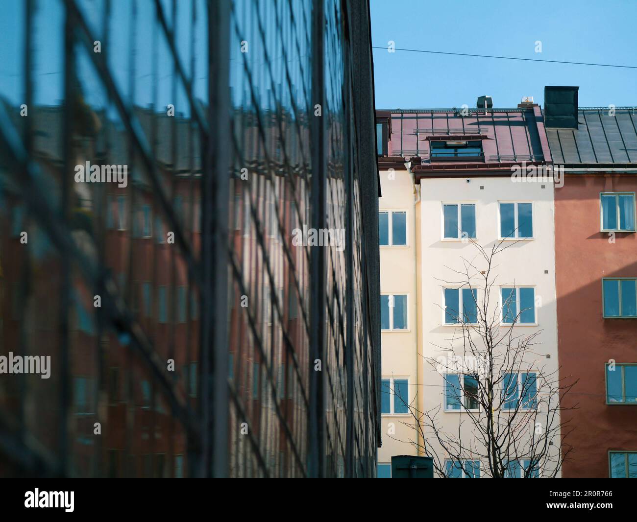 Reflection of buildings in windows during the day Stock Photo - Alamy