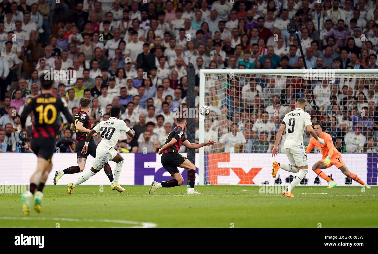 Real Madrid's Vinicius Junior scores their side's first goal of the ...