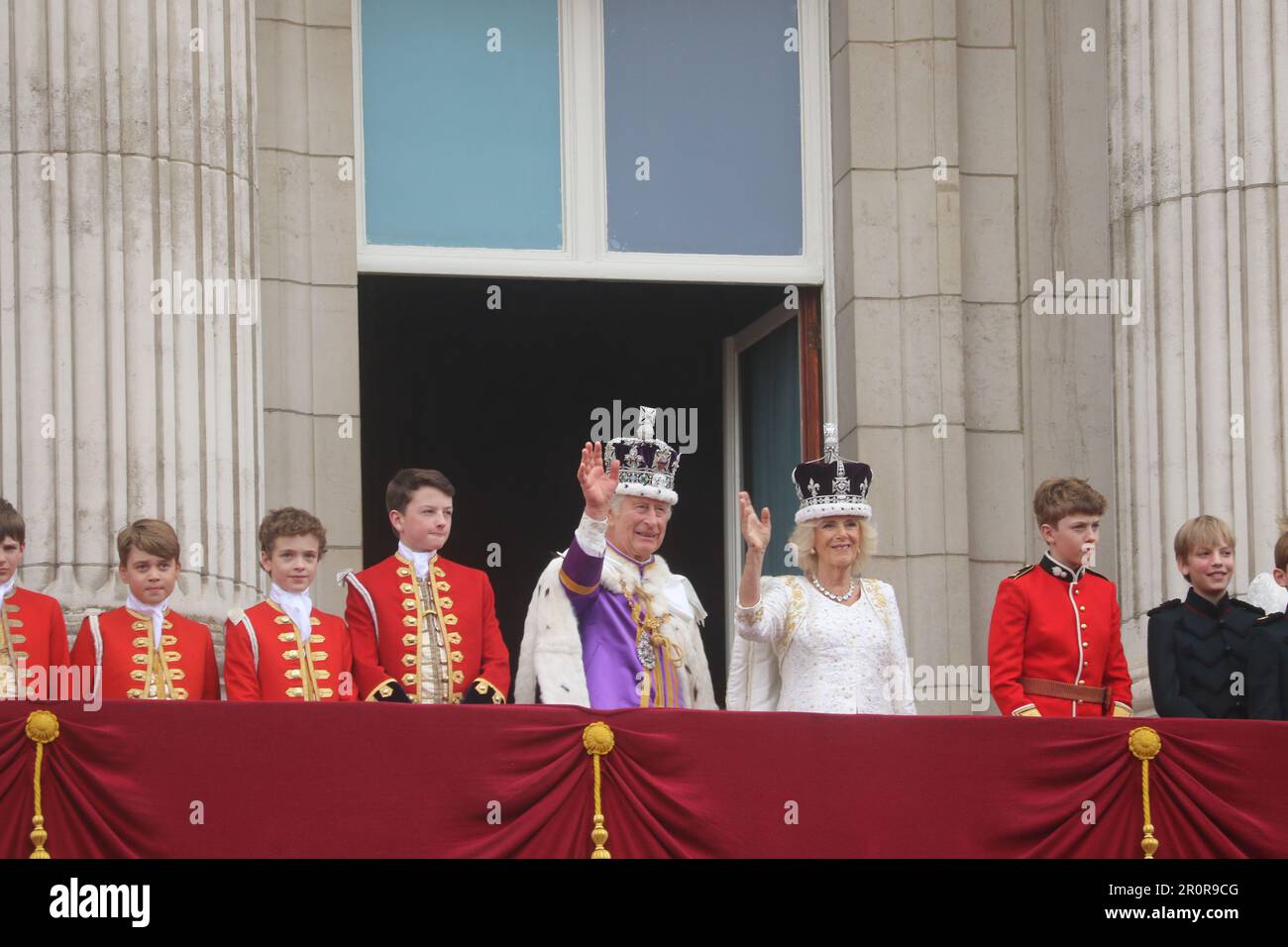 King Charles and Queen Camilla accompanied by their page boys on the ...
