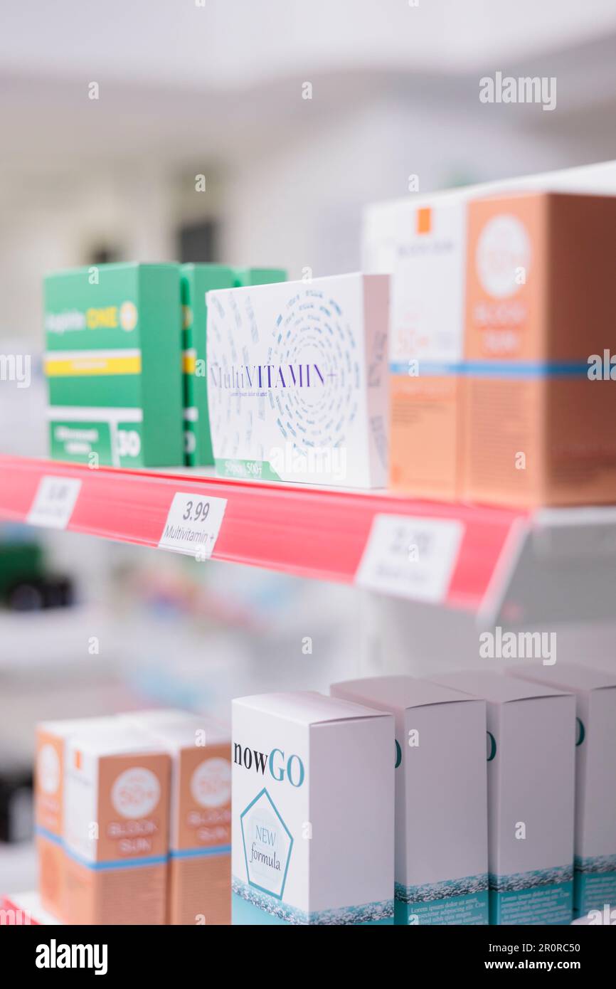 Selective focus of pharmacy shelves full with spf products and ...