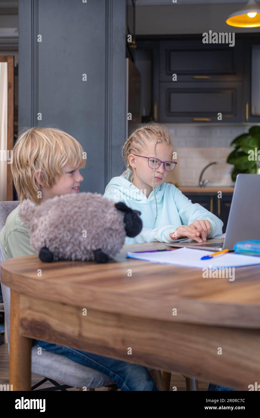 Online school class, siblings pupils boy and girl learning together ...