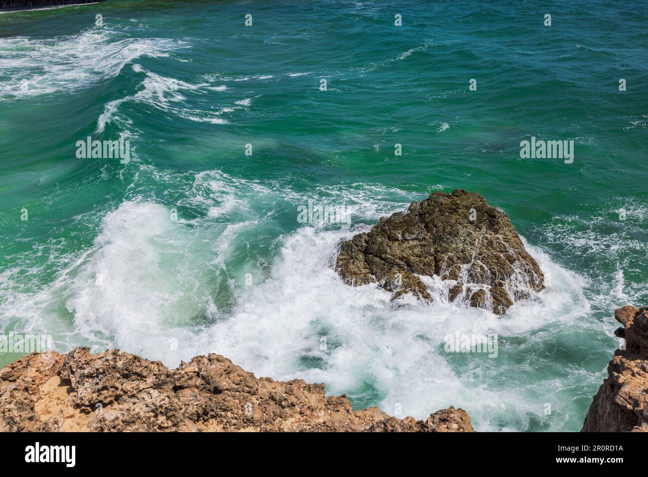Beautiful view of foamy waves between big rocks. Natural backgrounds ...