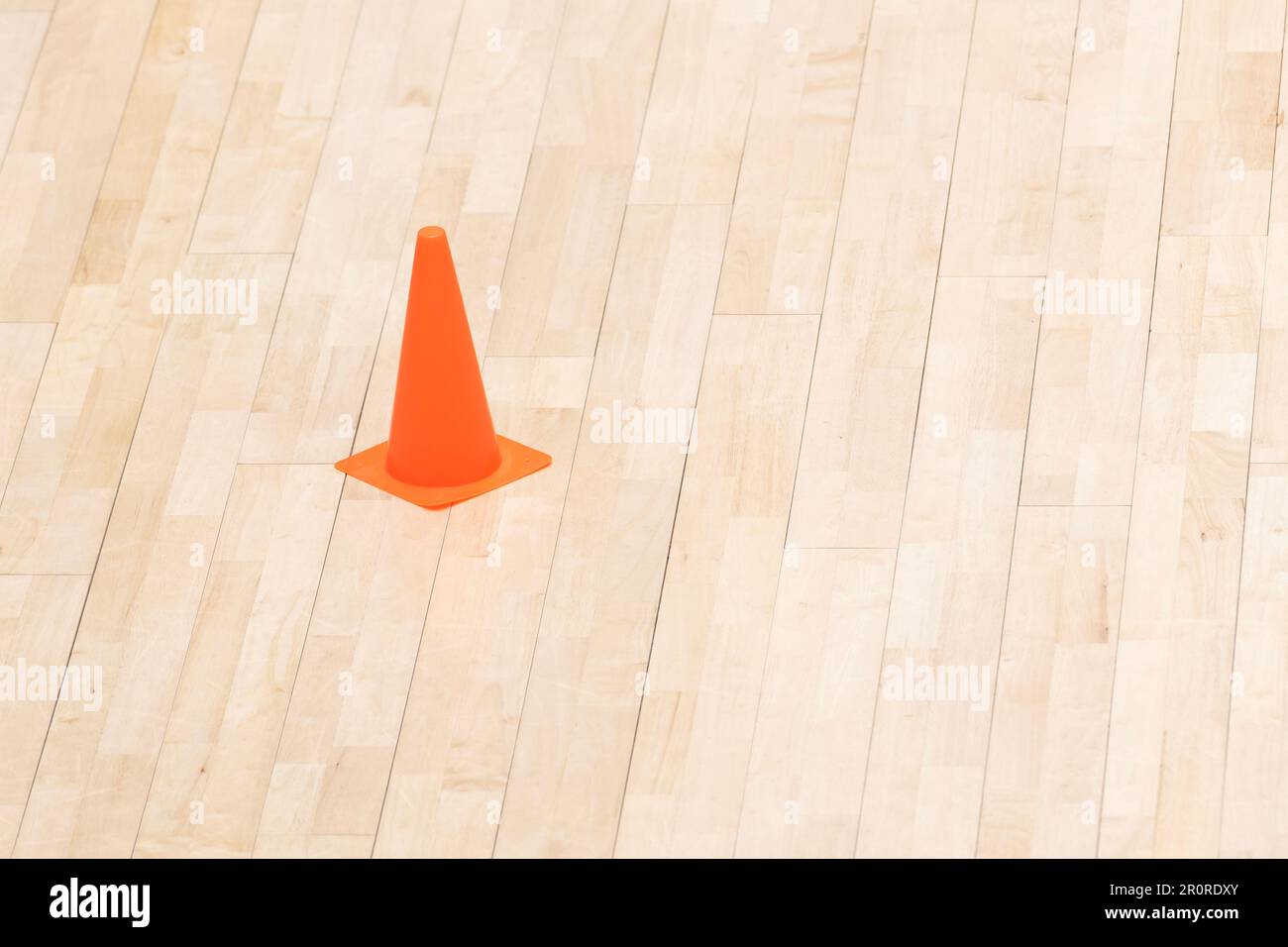 Training cones on hardwood court floor. Basketball, futsal, handball ...