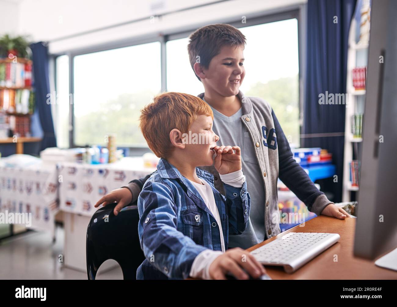 Surfing the internet with my buddy. elementary school children in class ...