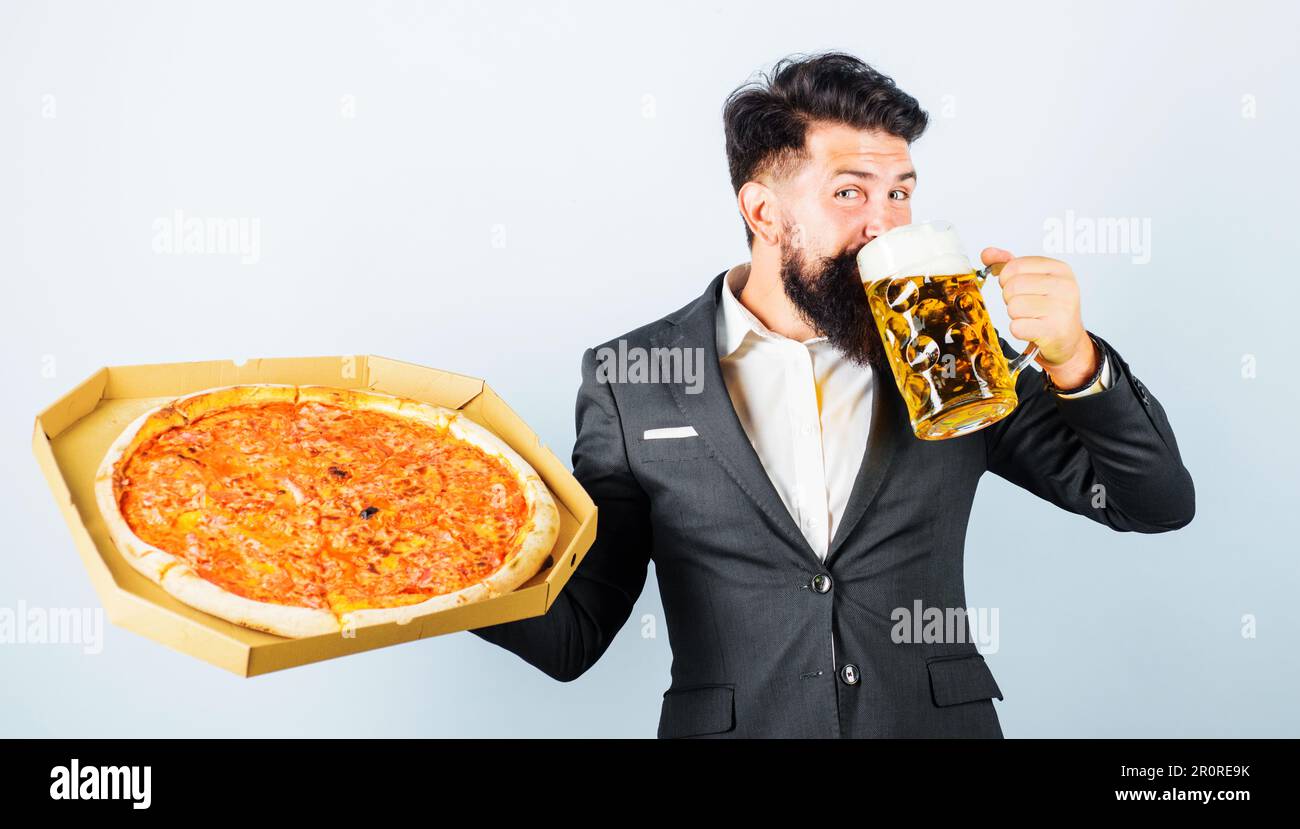 Pizza time. Happy bearded man with tasty pizza in box drinking beer ...