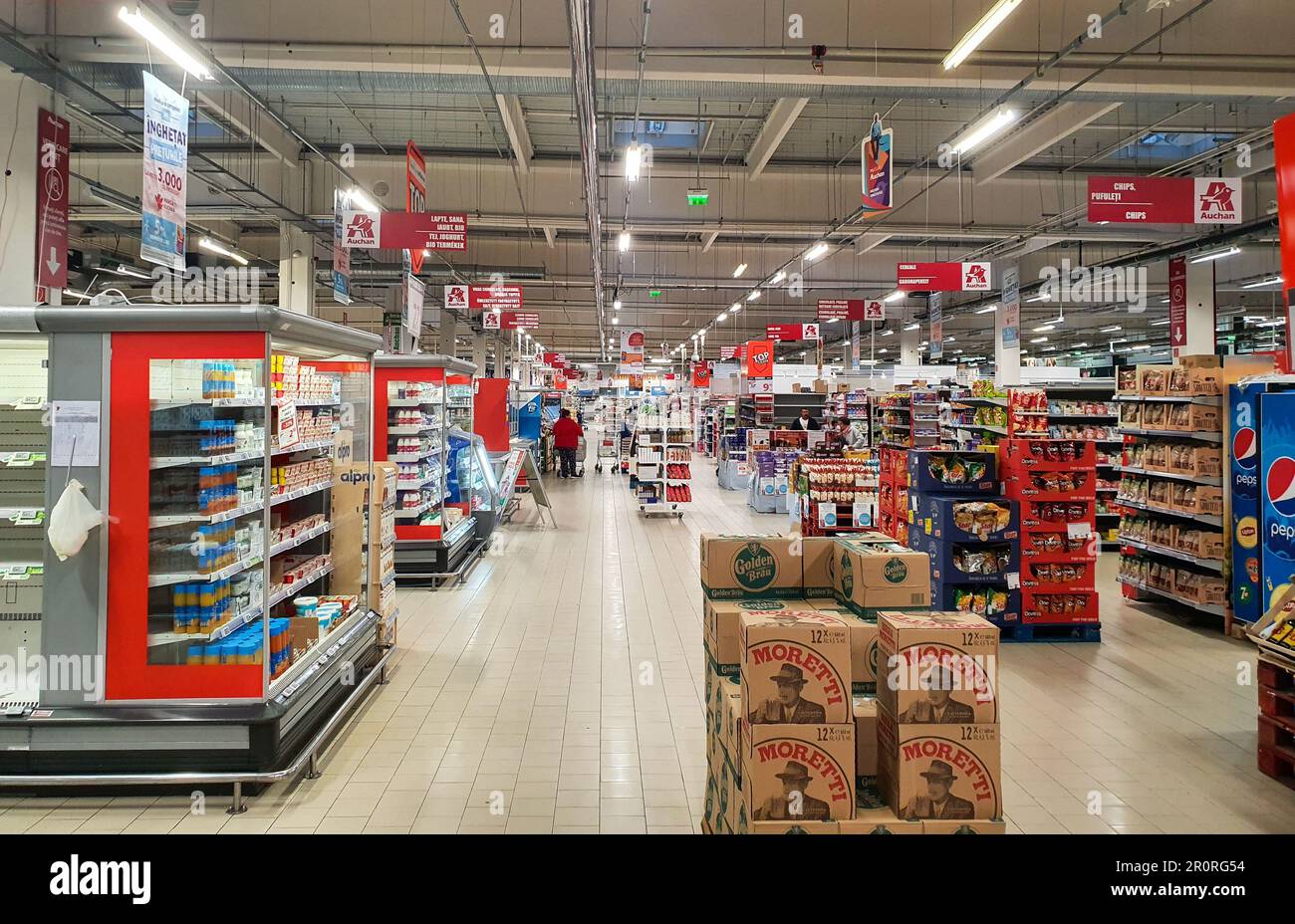 A view of the long aisles of a supermarket, showcasing a wide selection ...