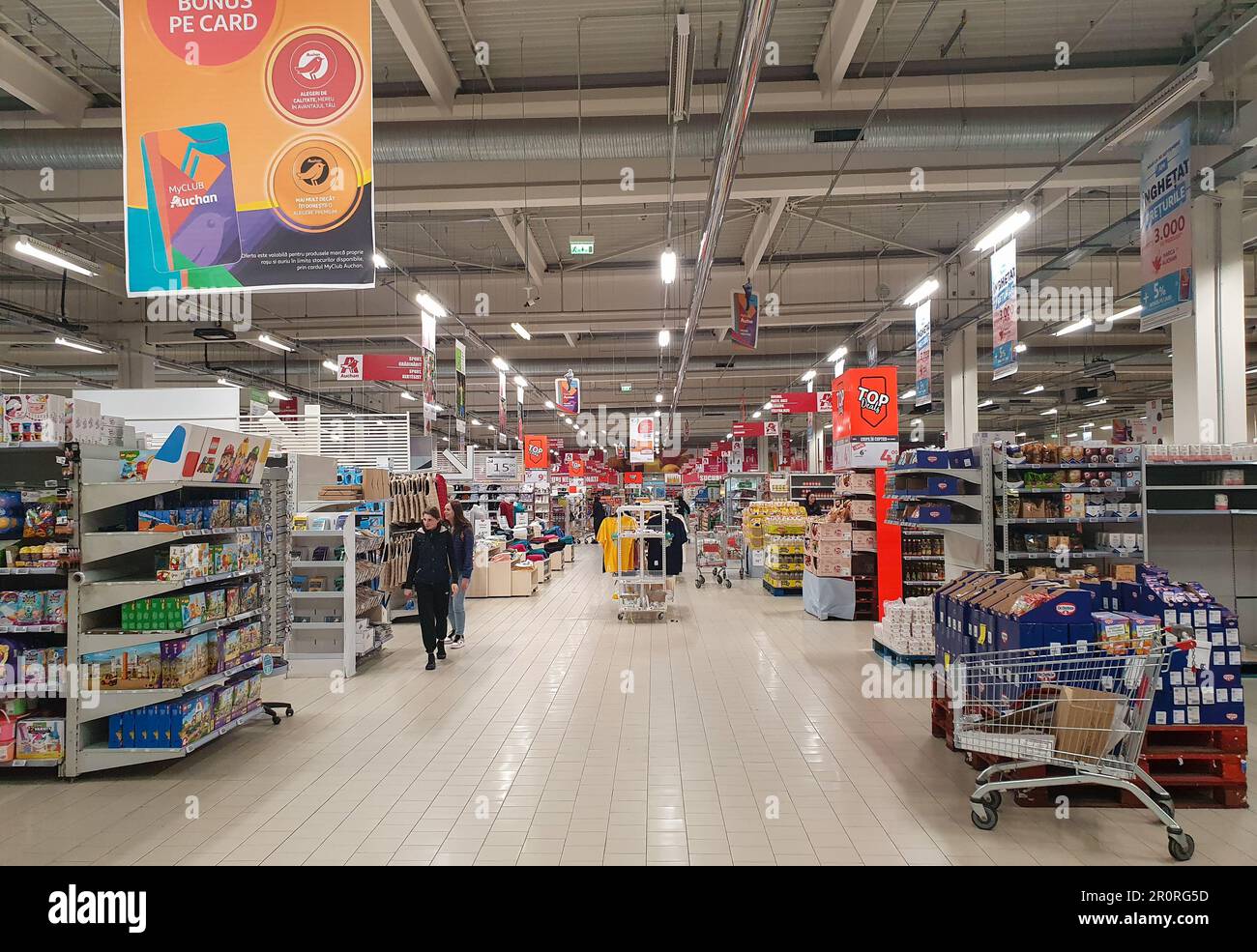 An expansive retail space with numerous shelves stocked with a variety ...