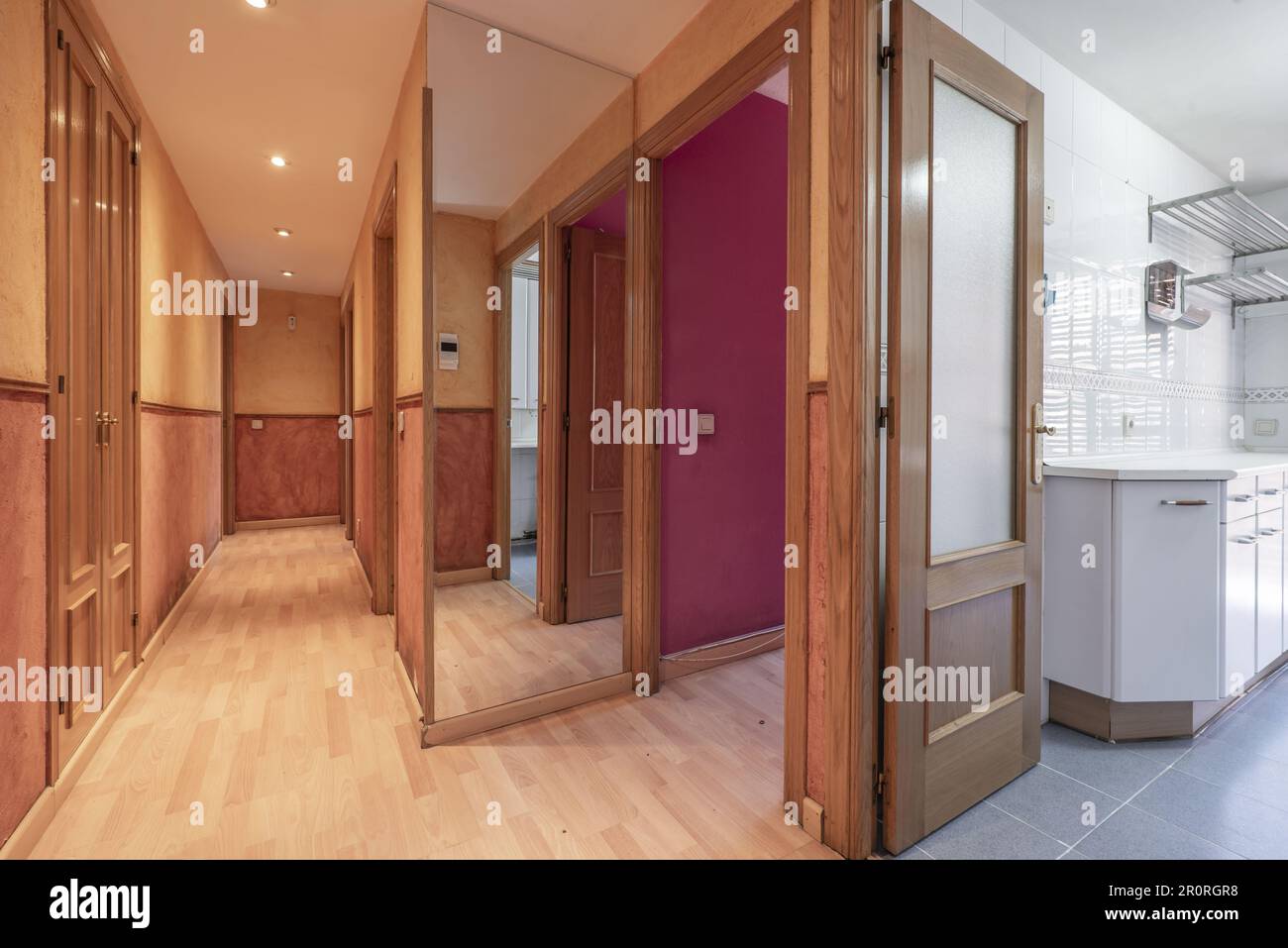 Distributor of a house with a hallway with closets and access doors to ...