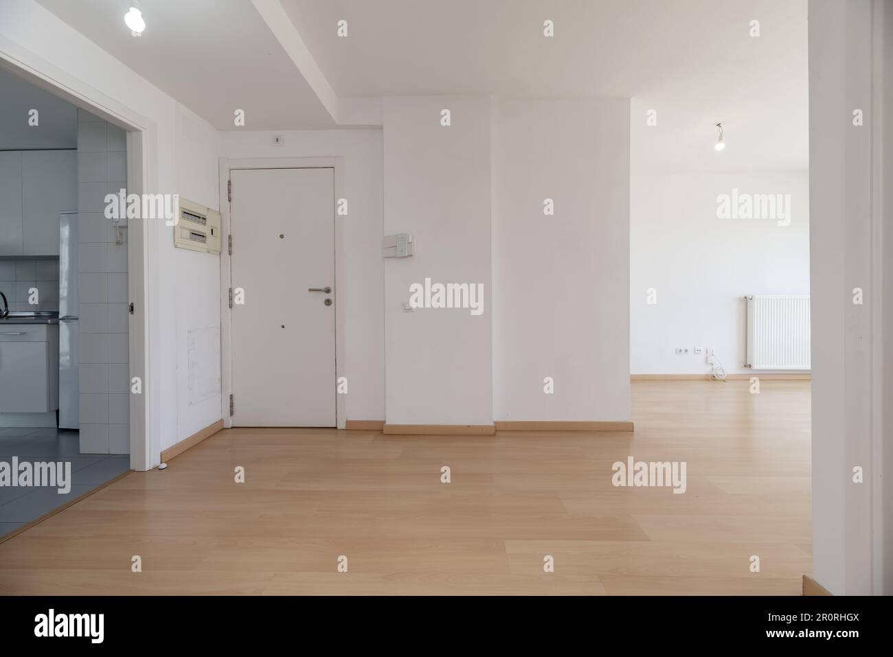 Entrance hall of an empty house with open spaces and walls painted in ...