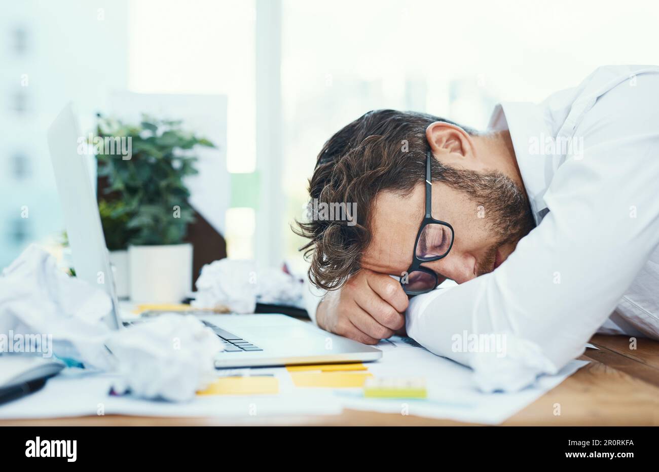 His work performance has taken a dive. a young businessman with his ...