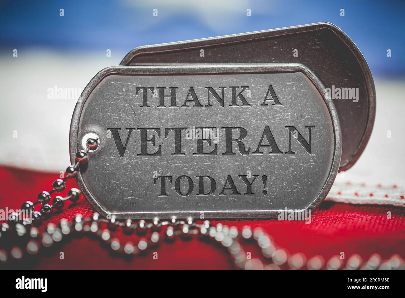 Worn US American dog tags on USA flag with Thank a Veteran Today ...