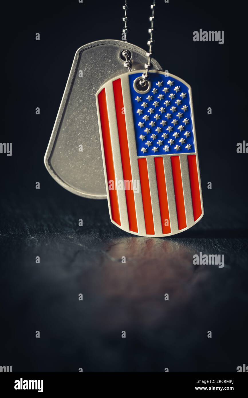 US military soldier's dog tags in the shape of the American flag ...