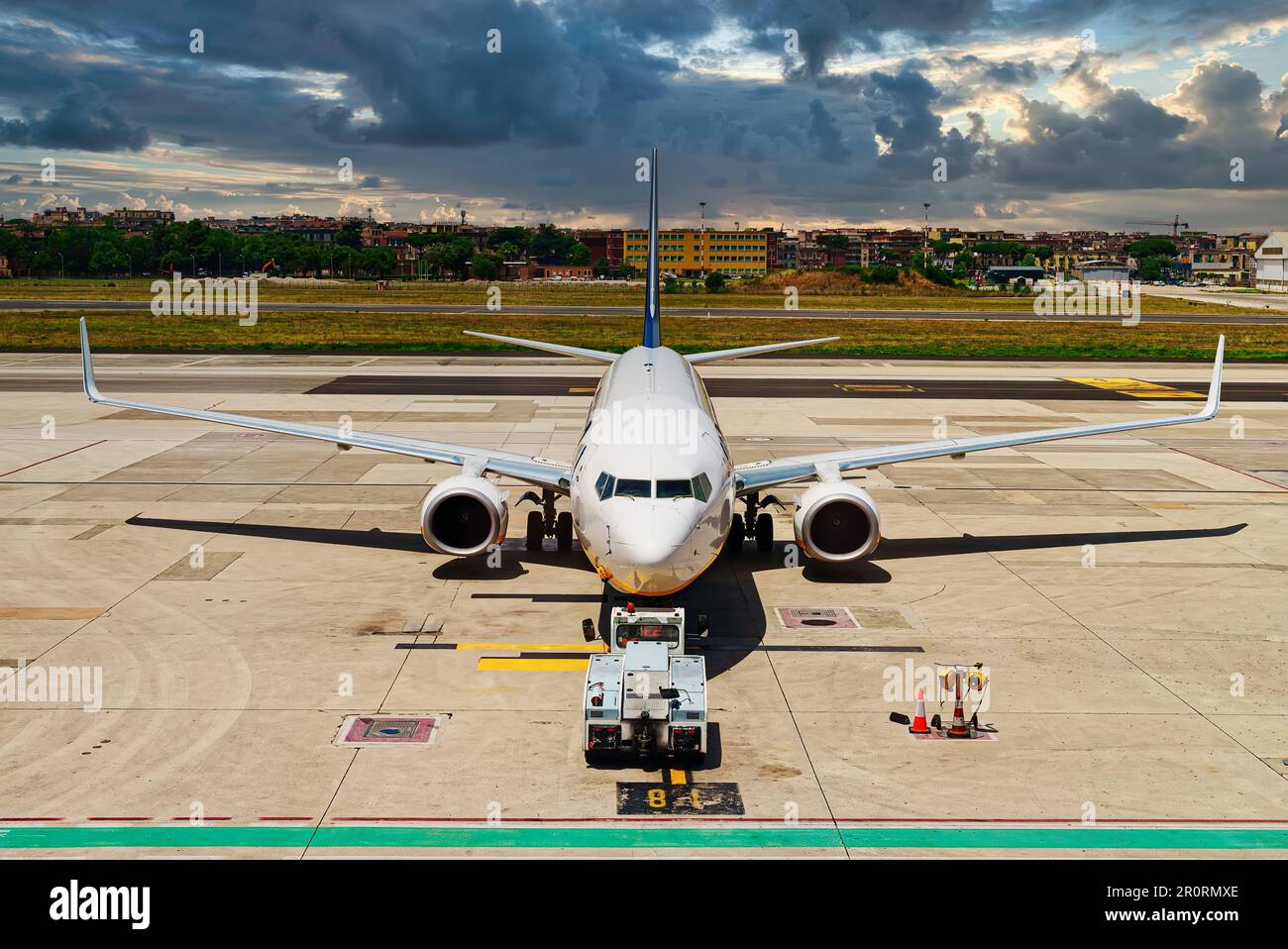 TUG Pushback tractor with Aircraft on the runway in airport Stock Photo ...