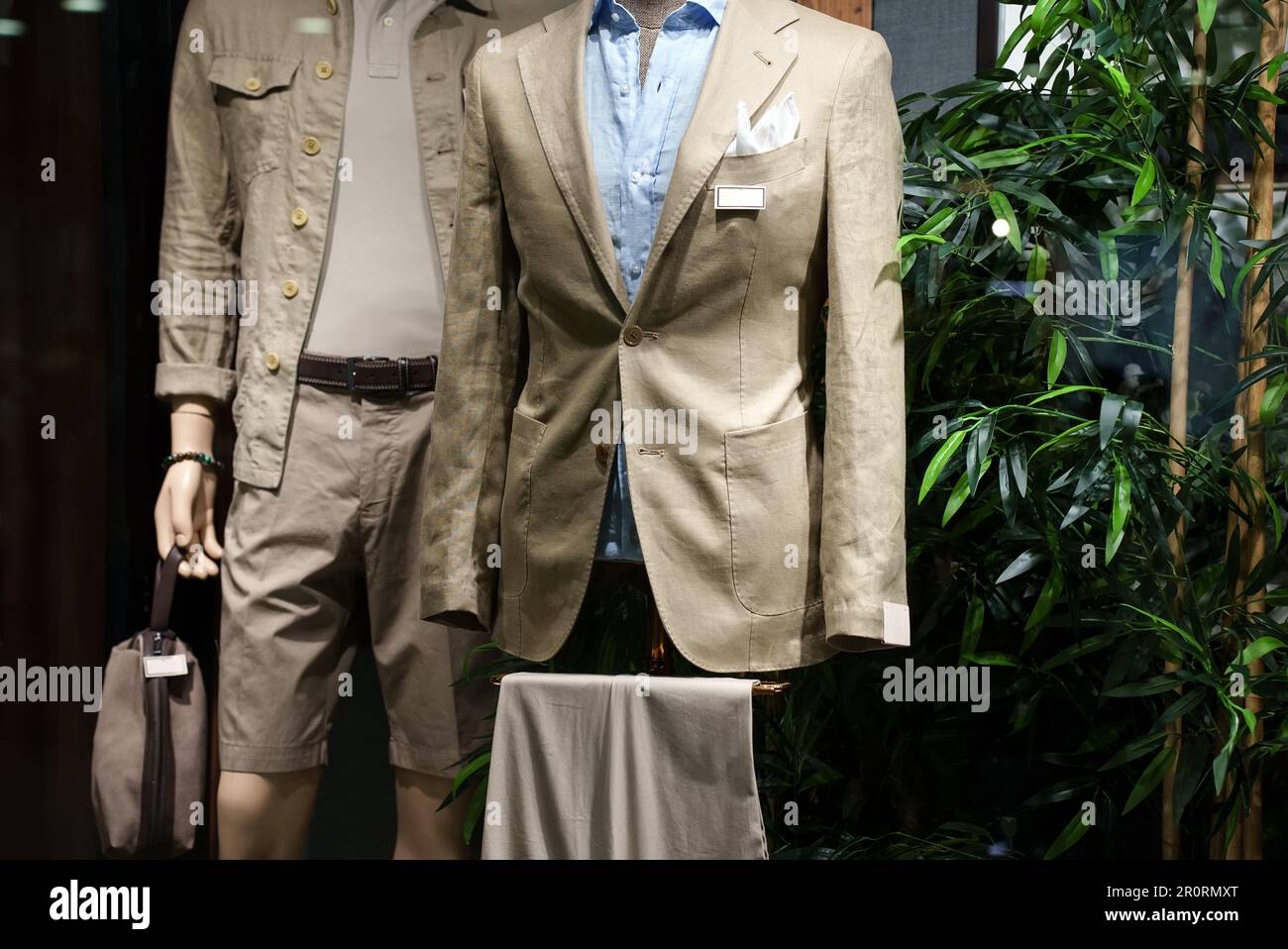 Men's summer clothes in a shop window Stock Photo - Alamy
