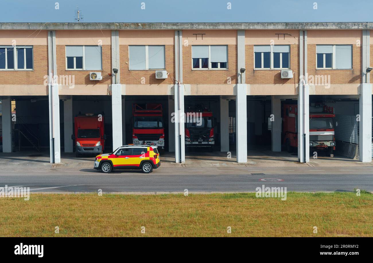 Fire station with fire trucks inside Stock Photo - Alamy
