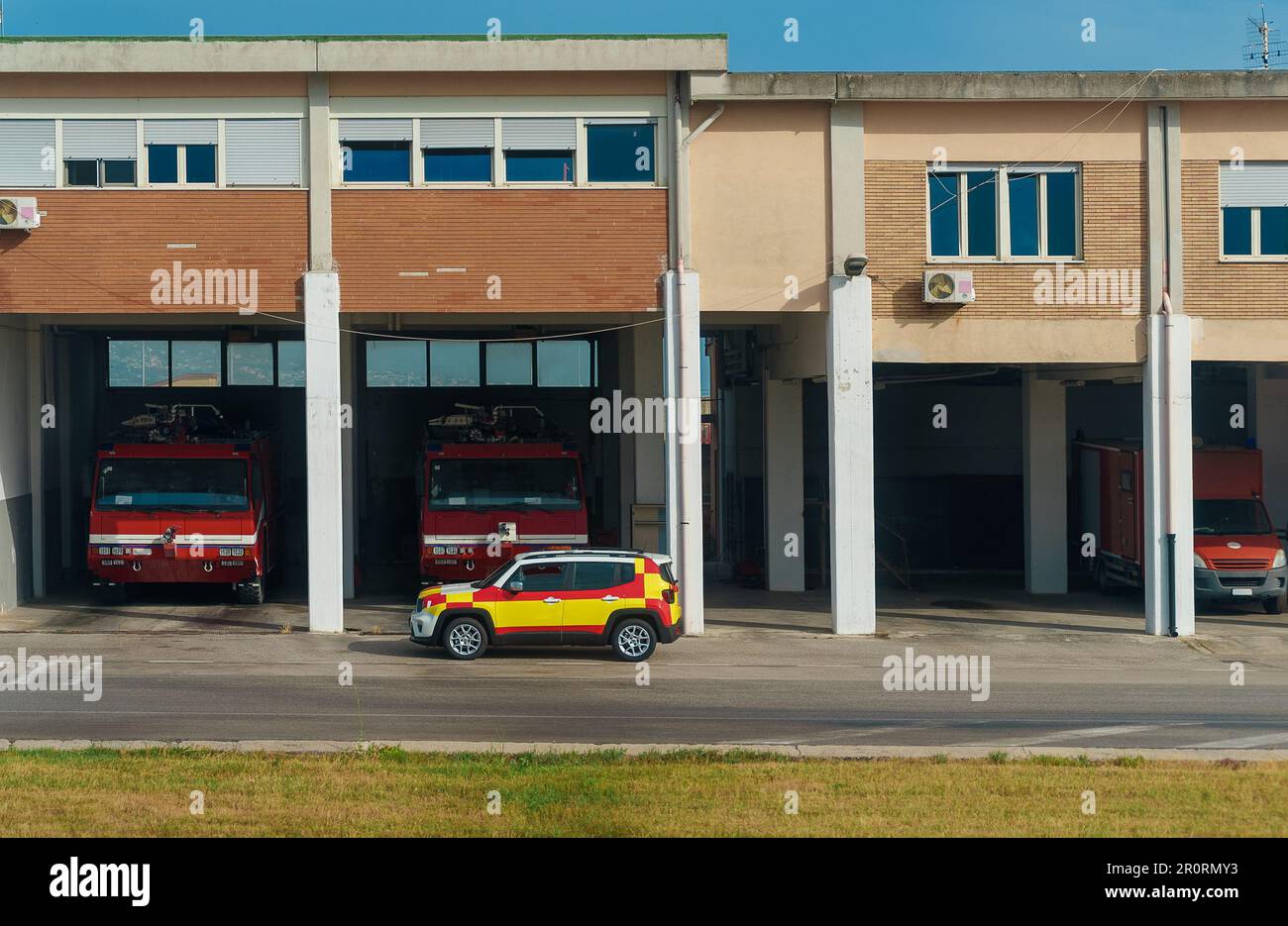 Fire station with fire trucks inside Stock Photo - Alamy