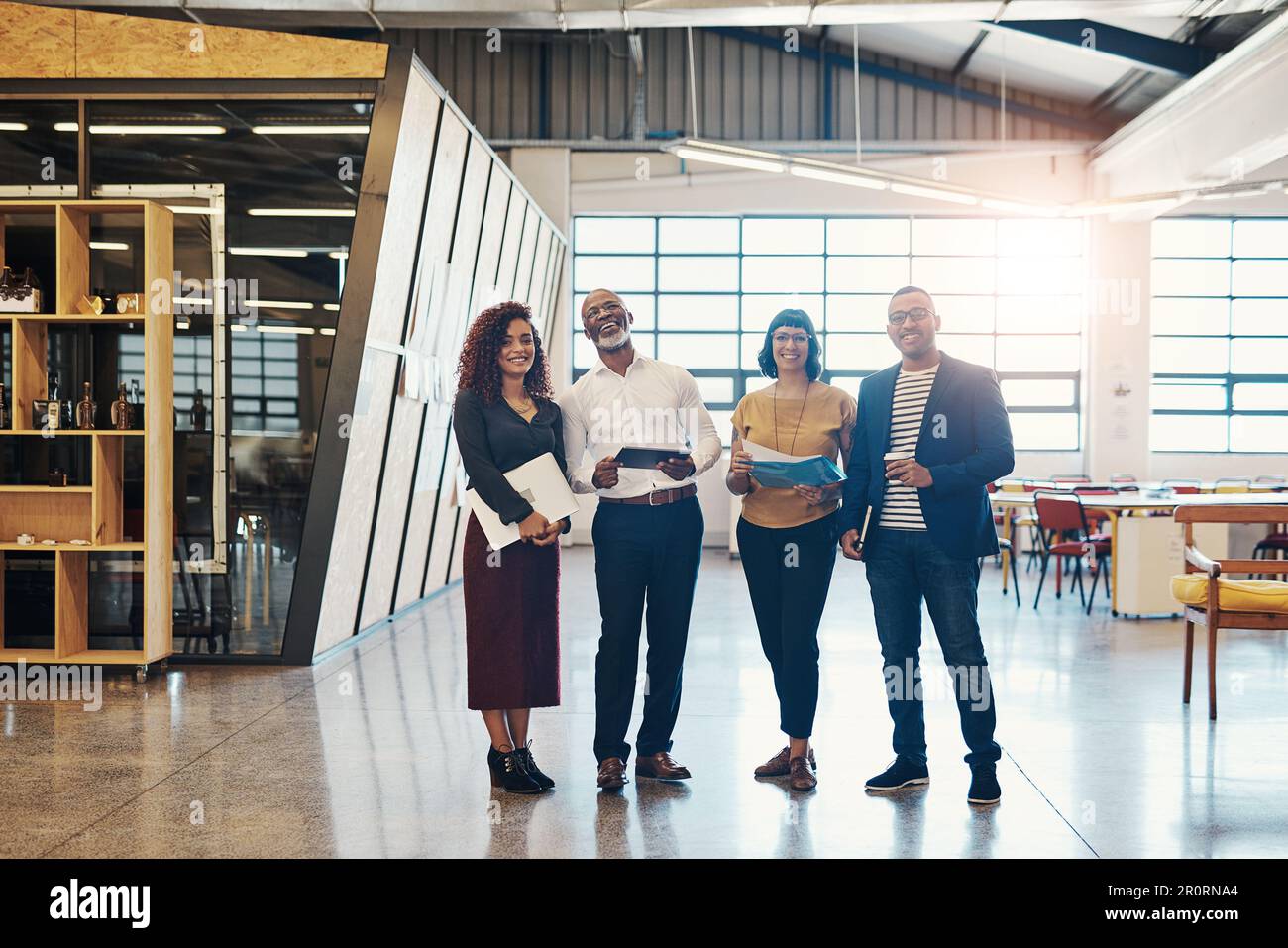 Success is about the attitude you have as a team. Portrait of a group ...