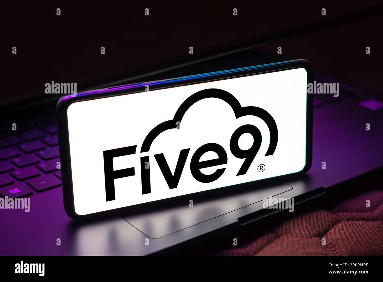 In this photo illustration, the Five9 Inc. logo is displayed on a smartphone screen Stock Photo ...
