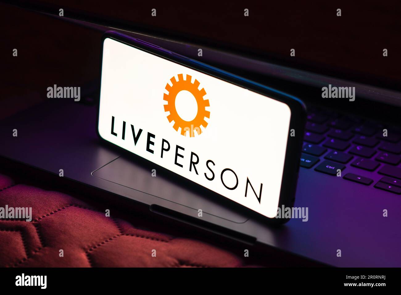 In this photo illustration, the LivePerson logo is displayed on a ...
