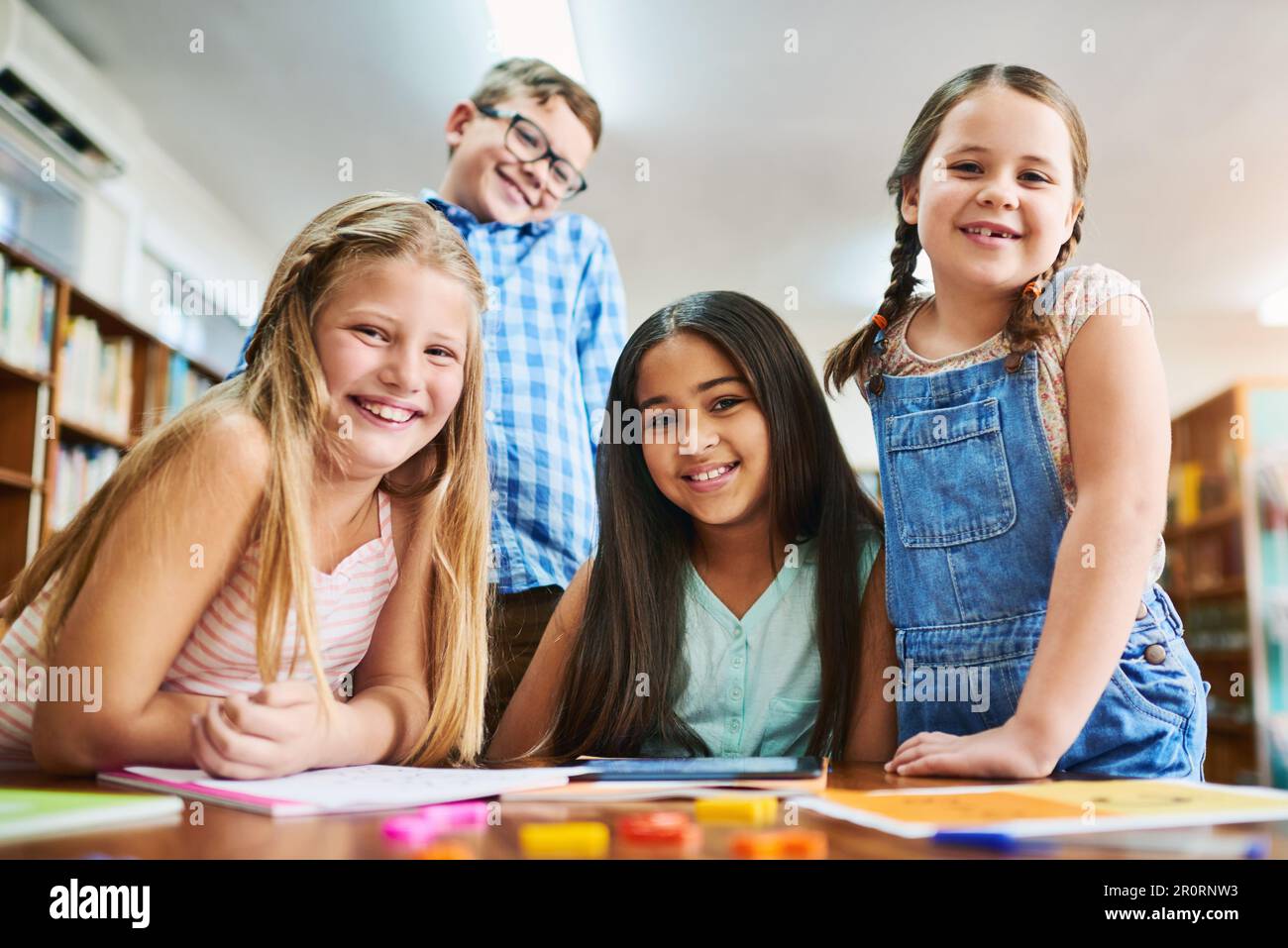 Education is our first priority. Portrait of a group of cheerful young ...