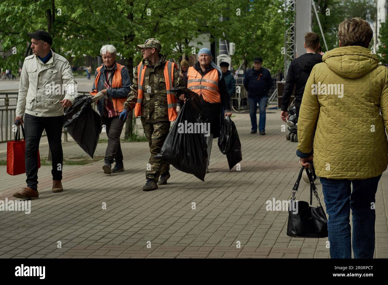 Street garbage cleaners clean the street along the Koltsovsky Square on ...