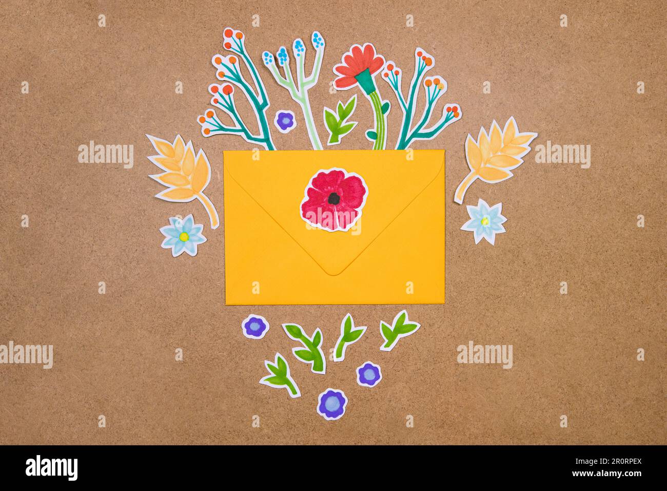 Envelope with paper hand drawn flowers deco arrangement on neutral ...