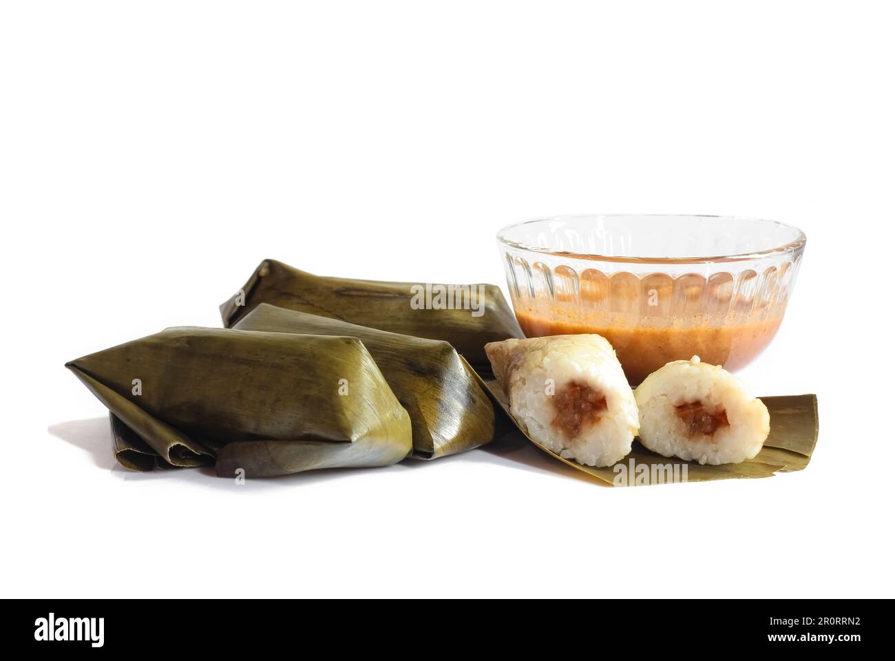 Lontong isolated on white background. Lontong is rice wrapped in banana ...