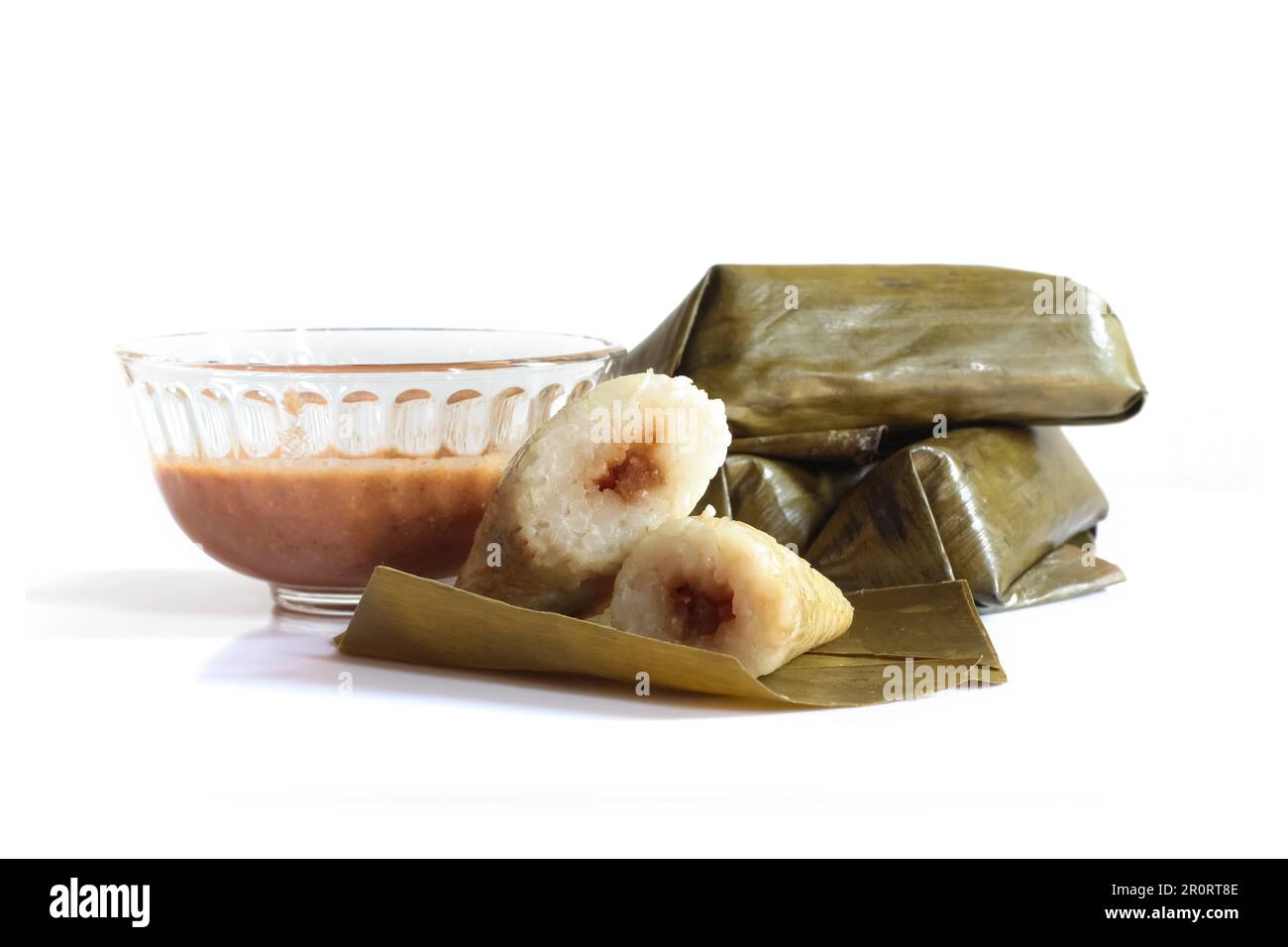 Lontong isolated on white background. Lontong is rice wrapped in banana ...