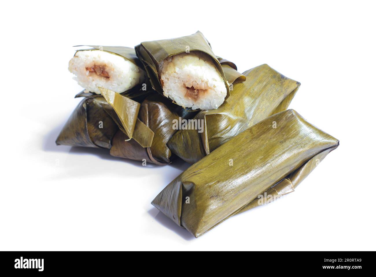 Lontong isolated on white background. Lontong is rice wrapped in banana ...