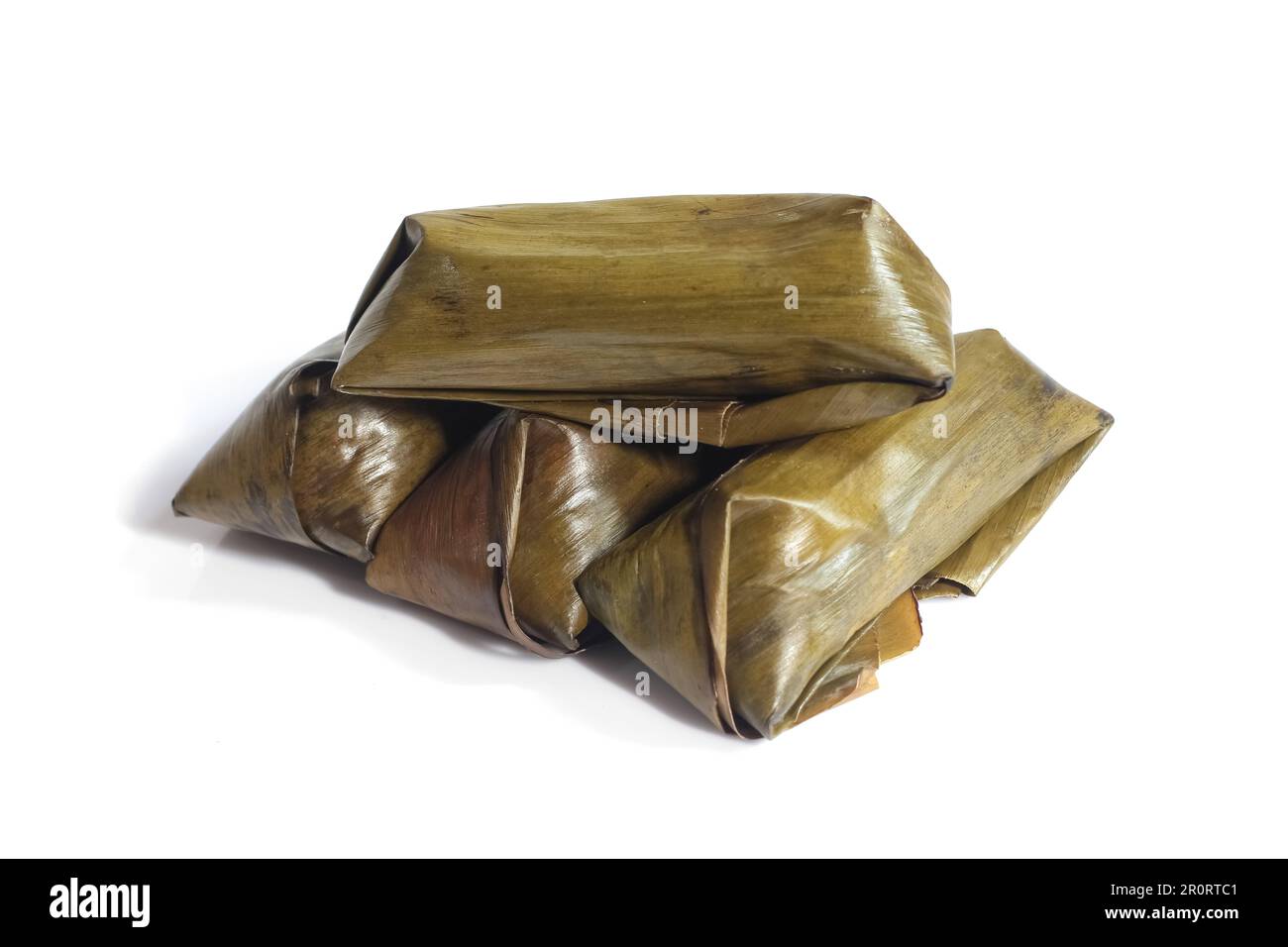Lontong isolated on white background. Lontong is rice wrapped in banana ...