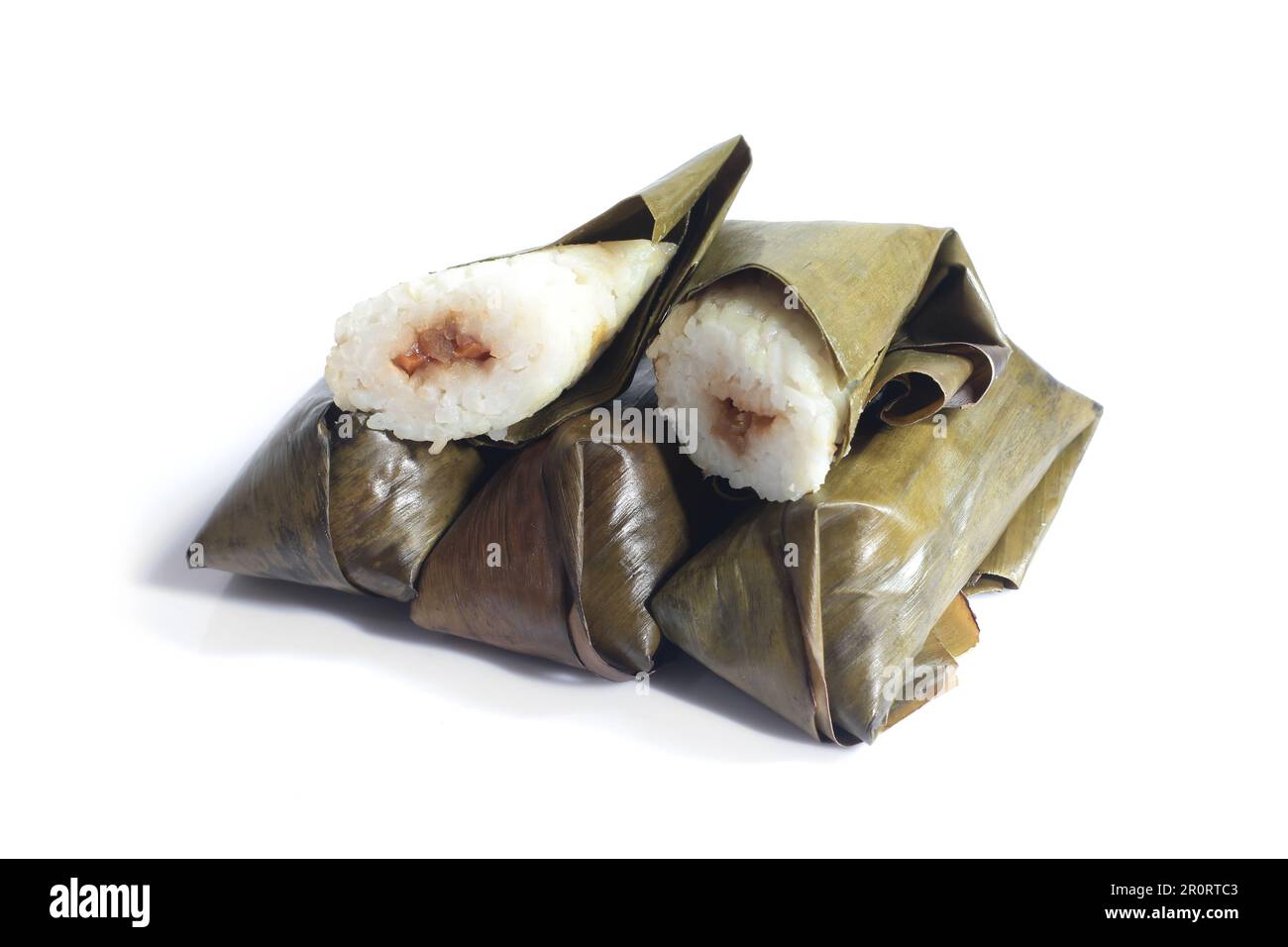 Lontong isolated on white background. Lontong is rice wrapped in banana ...