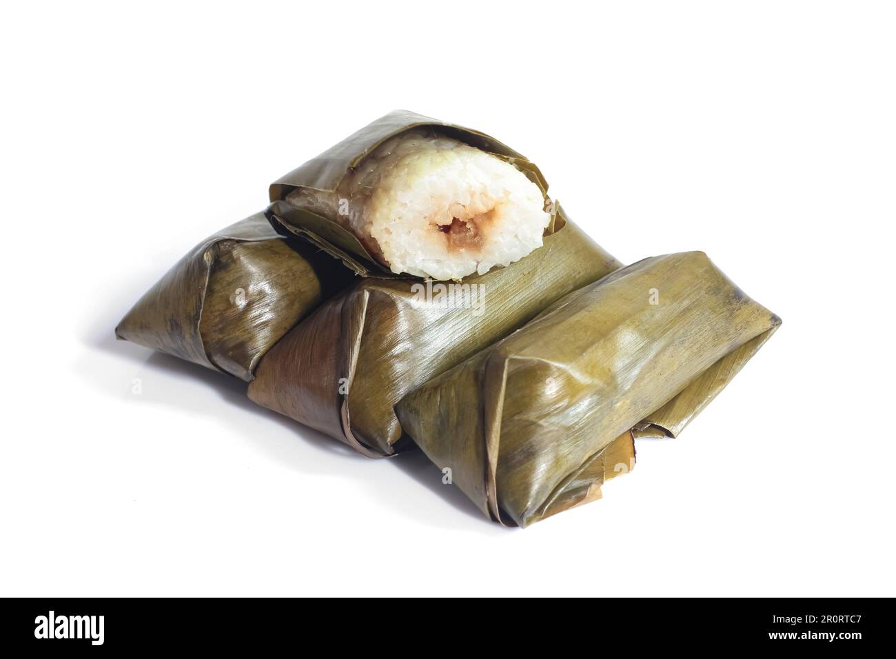 Lontong isolated on white background. Lontong is rice wrapped in banana ...