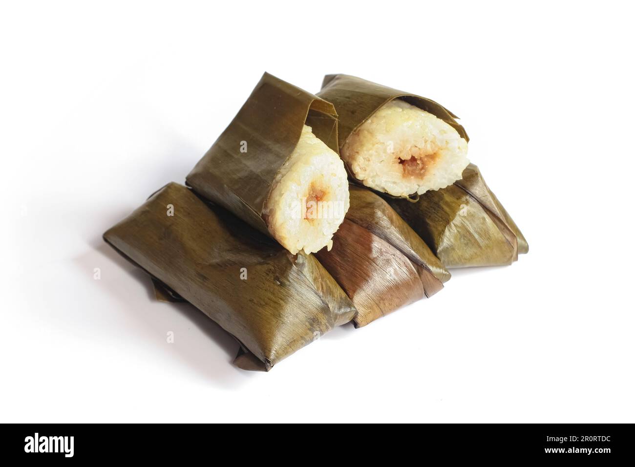 Lontong isolated on white background. Lontong is rice wrapped in banana ...
