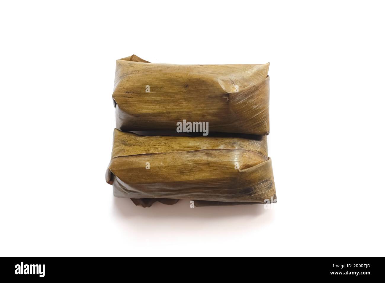 Lontong isolated on white background. Lontong is rice wrapped in banana ...