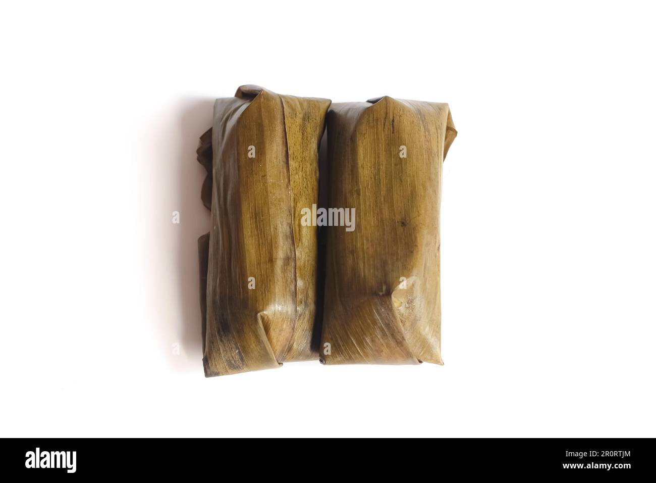 Lontong isolated on white background. Lontong is rice wrapped in banana ...