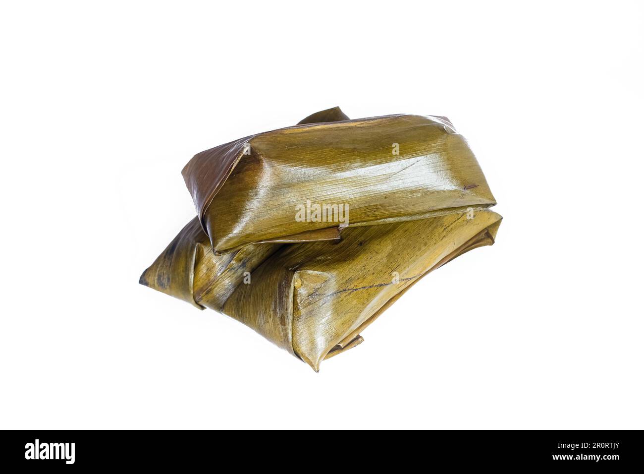 Lontong isolated on white background. Lontong is rice wrapped in banana ...