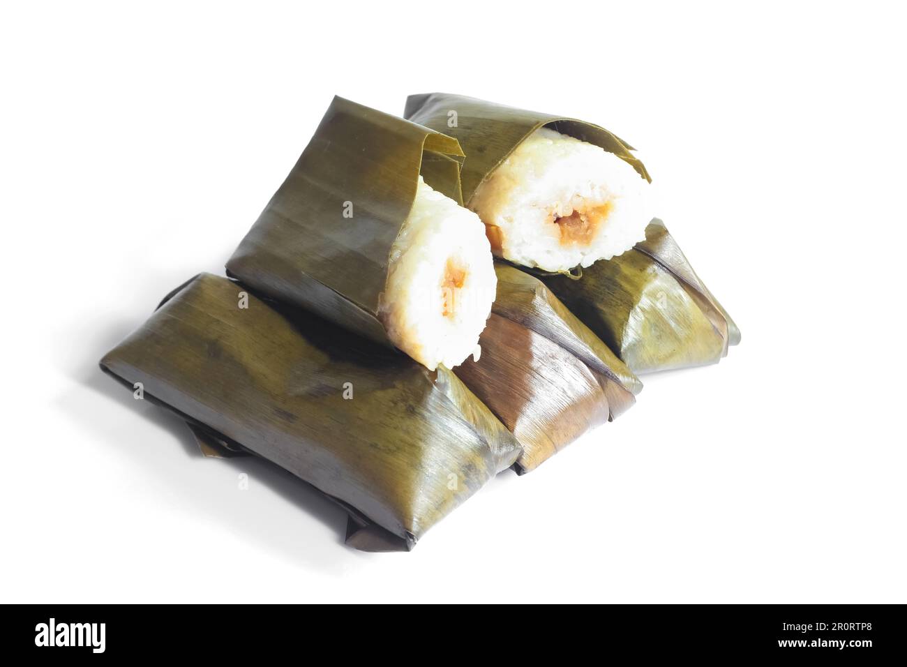 Lontong isolated on white background. Lontong is rice wrapped in banana ...